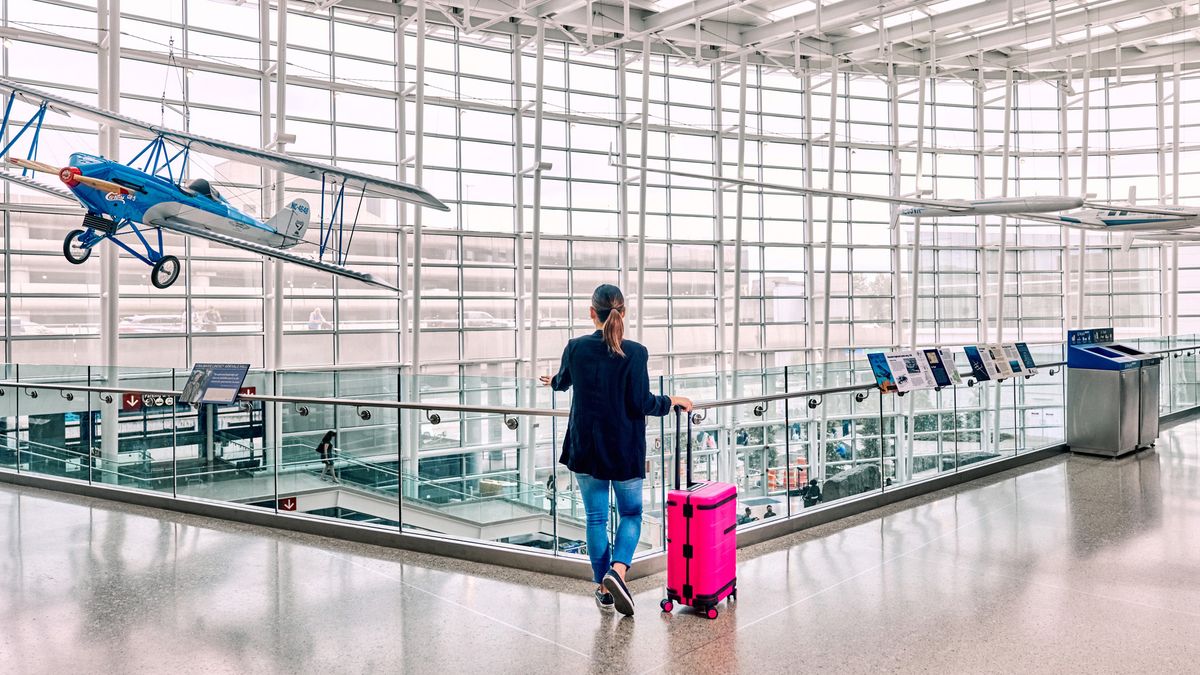 T-Mobile rolled out a hot magenta smart suitcase, and I want it | TechRadar