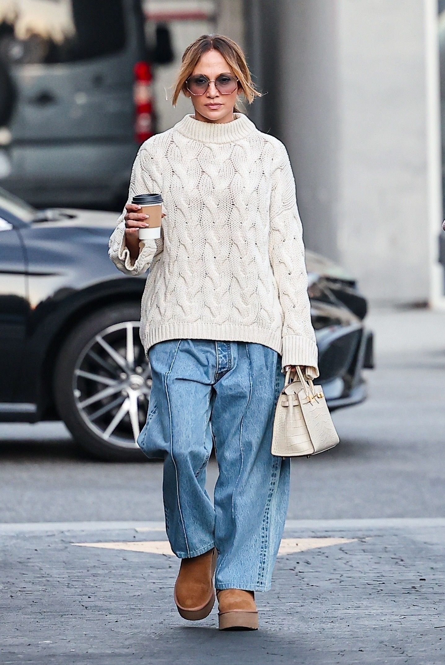 Jennifer Lopez Stacks a Cable Knit Sweater, Uggs, and a Rare, $80,000 ...