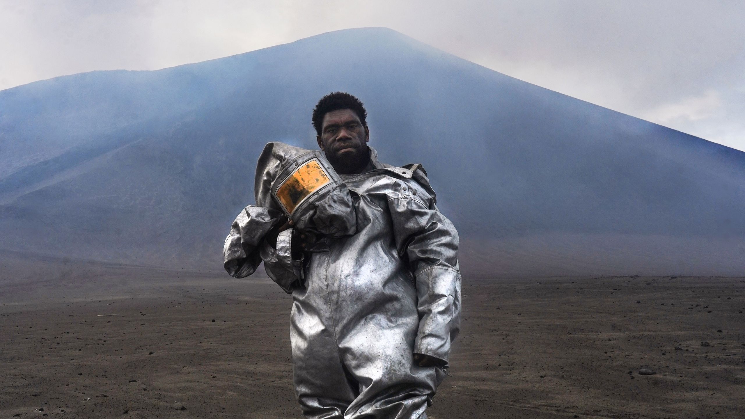 Vanuatu's 'barefoot volcanologist' stands at ash- and sulfur-spewing ...