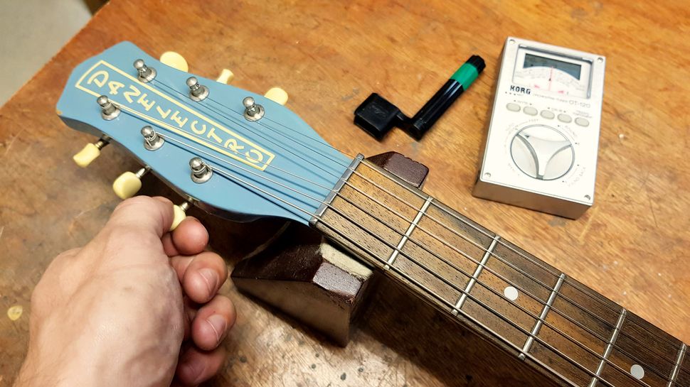 A tech explains how to change your electric guitar strings like a pro ...