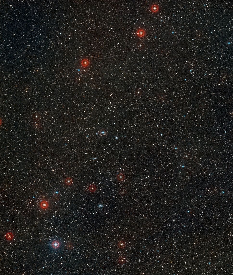 Galaxy Distorted by Long-Ago Collision Glows in Gorgeous Hubble Photo ...