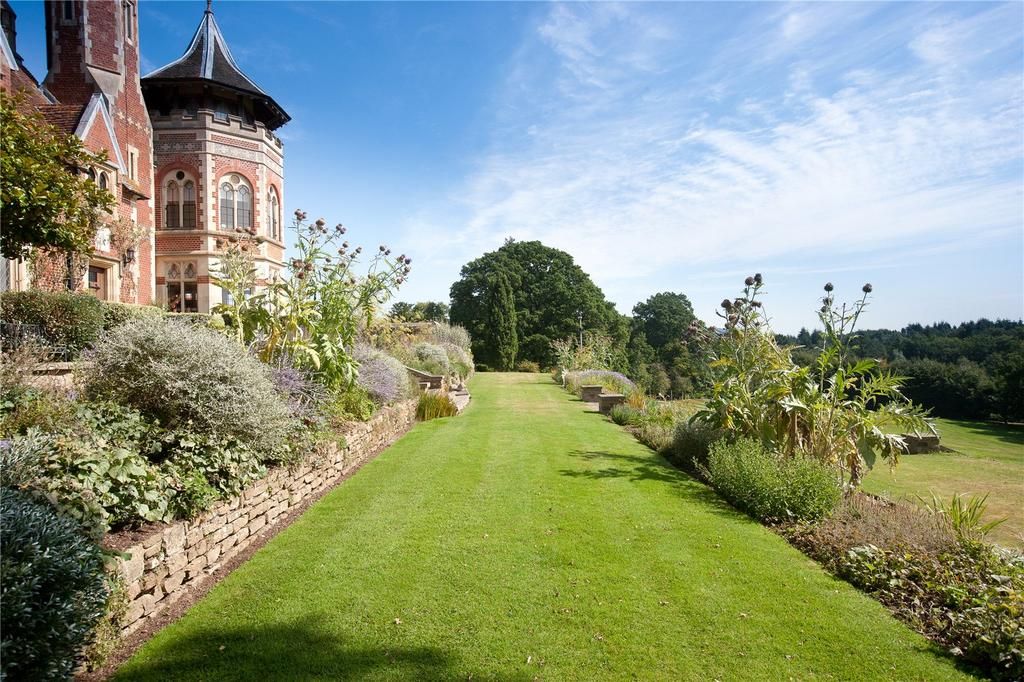 An £18 million Surrey mansion, with vaulted hall, turrets, and a ...