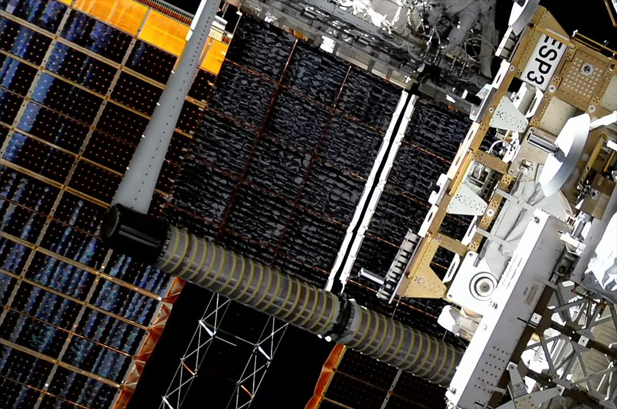 NASA astronauts on station spacewalk deploy roll-out solar array | Space