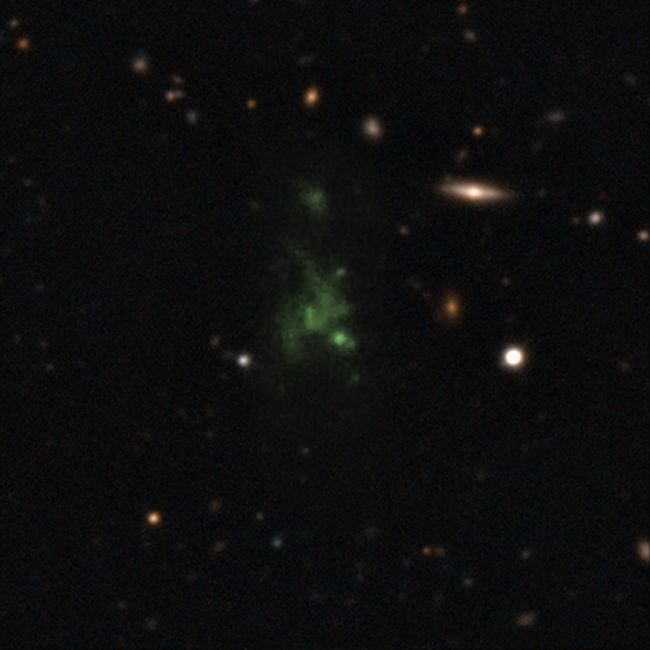 Giant Space 'Blob' Glows Green From Galaxies Within | Space