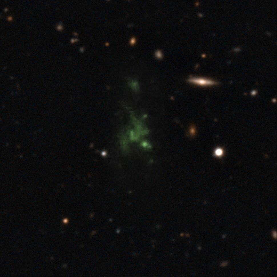 Giant Space 'Blob' Glows Green From Galaxies Within | Space