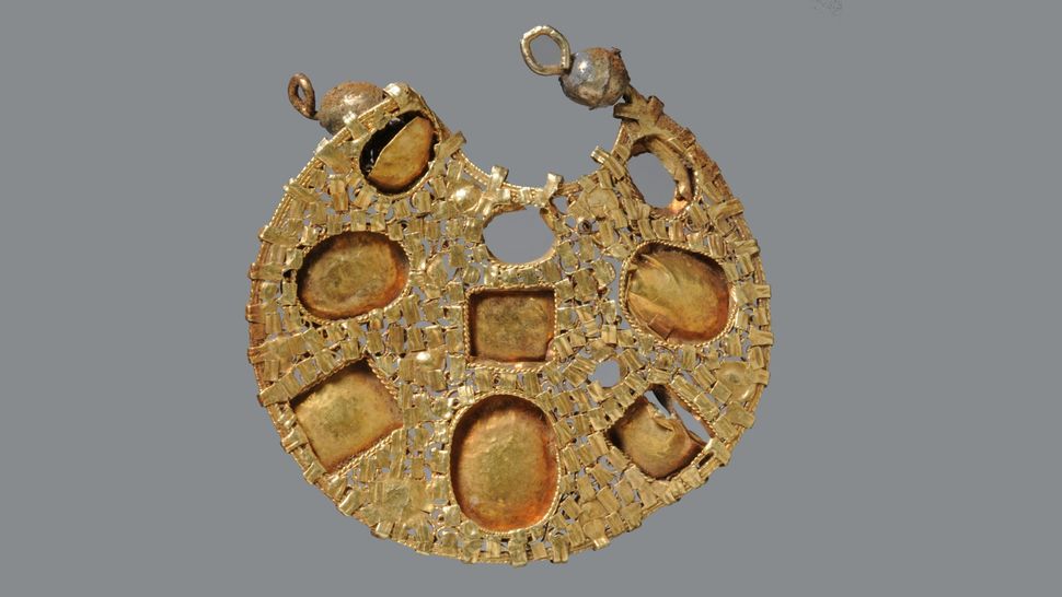 Stunning gem-covered gold earrings found in 800-year-old hoard in ...