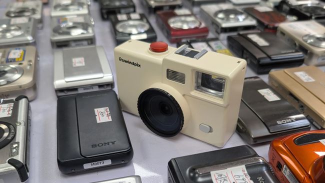 This compact camera looks like a disposable film cam, but the retro ...