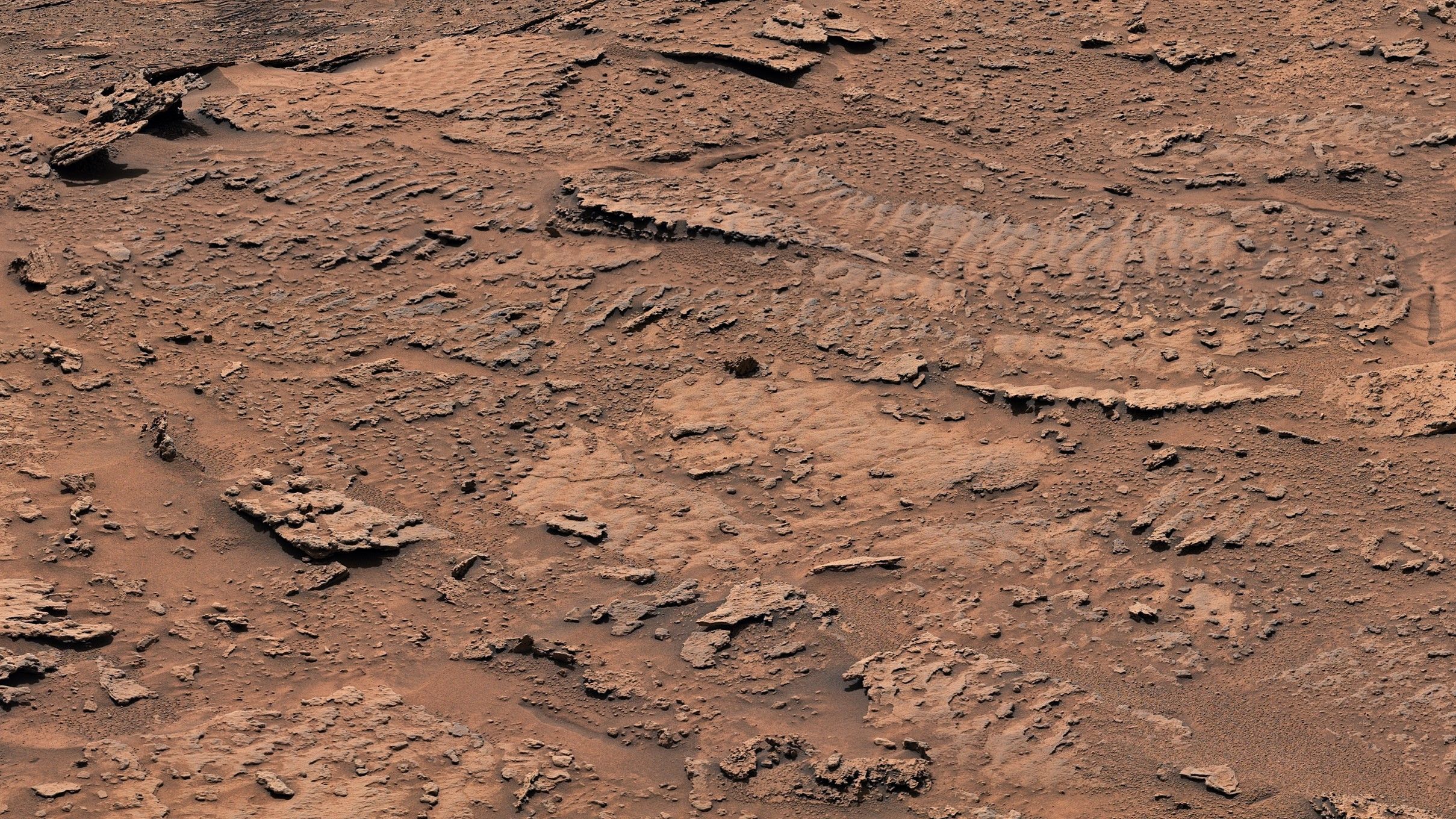 NASA rover snaps photos of ancient 'waves' carved into Mars ...