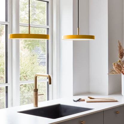 Over sink kitchen lighting ideas to illuminate your basin area | Ideal Home