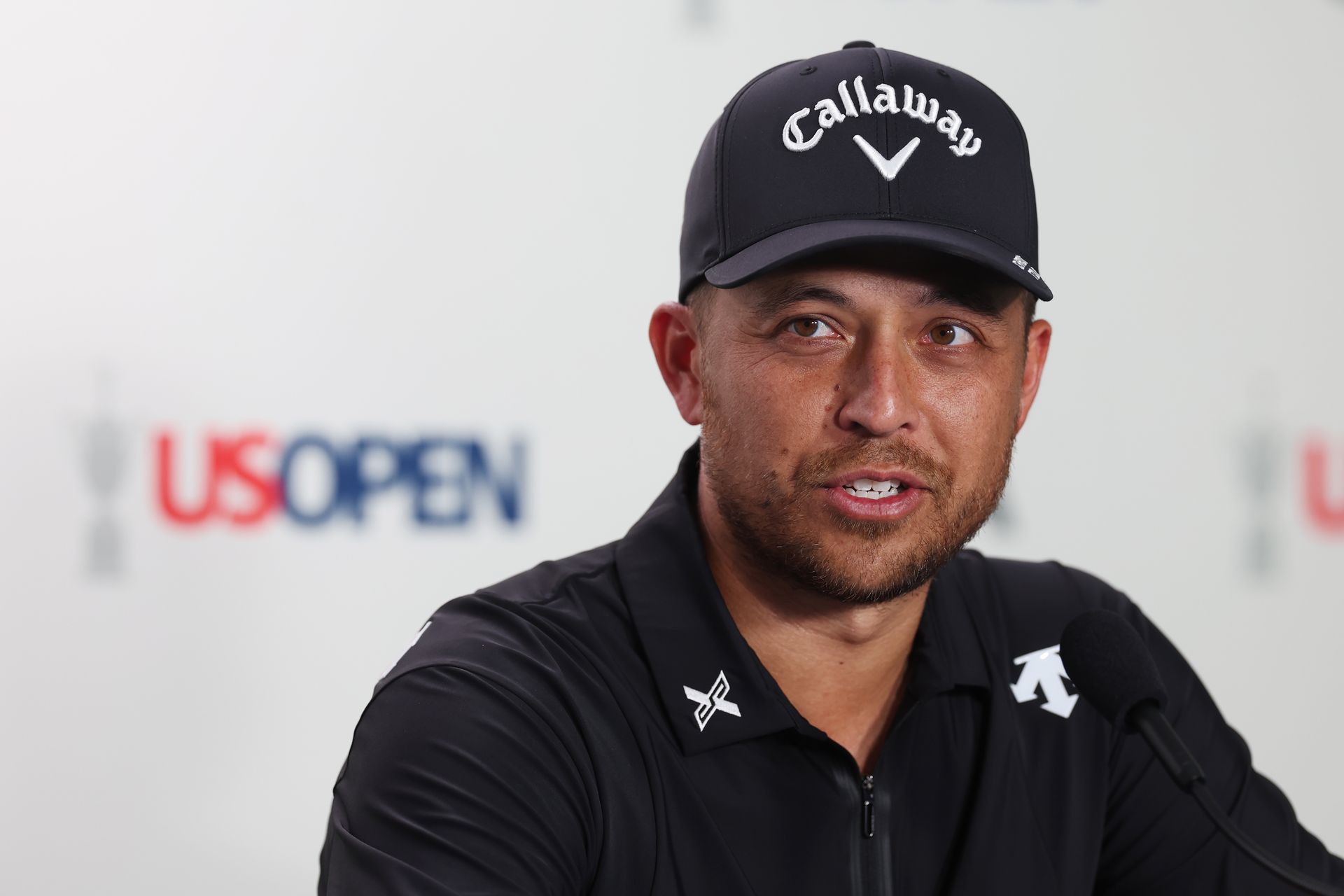 What Is The X Logo On Xander Schauffele's Shirt? | Golf Monthly