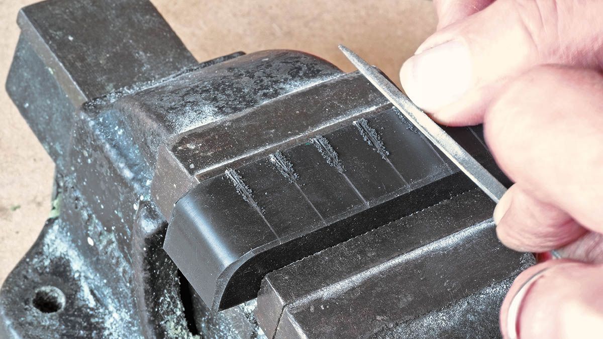 How to install a rubber bridge on an electric guitar | Guitar World