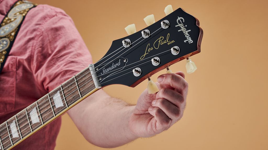 How to tune an electric guitar with a tuner | Guitar World