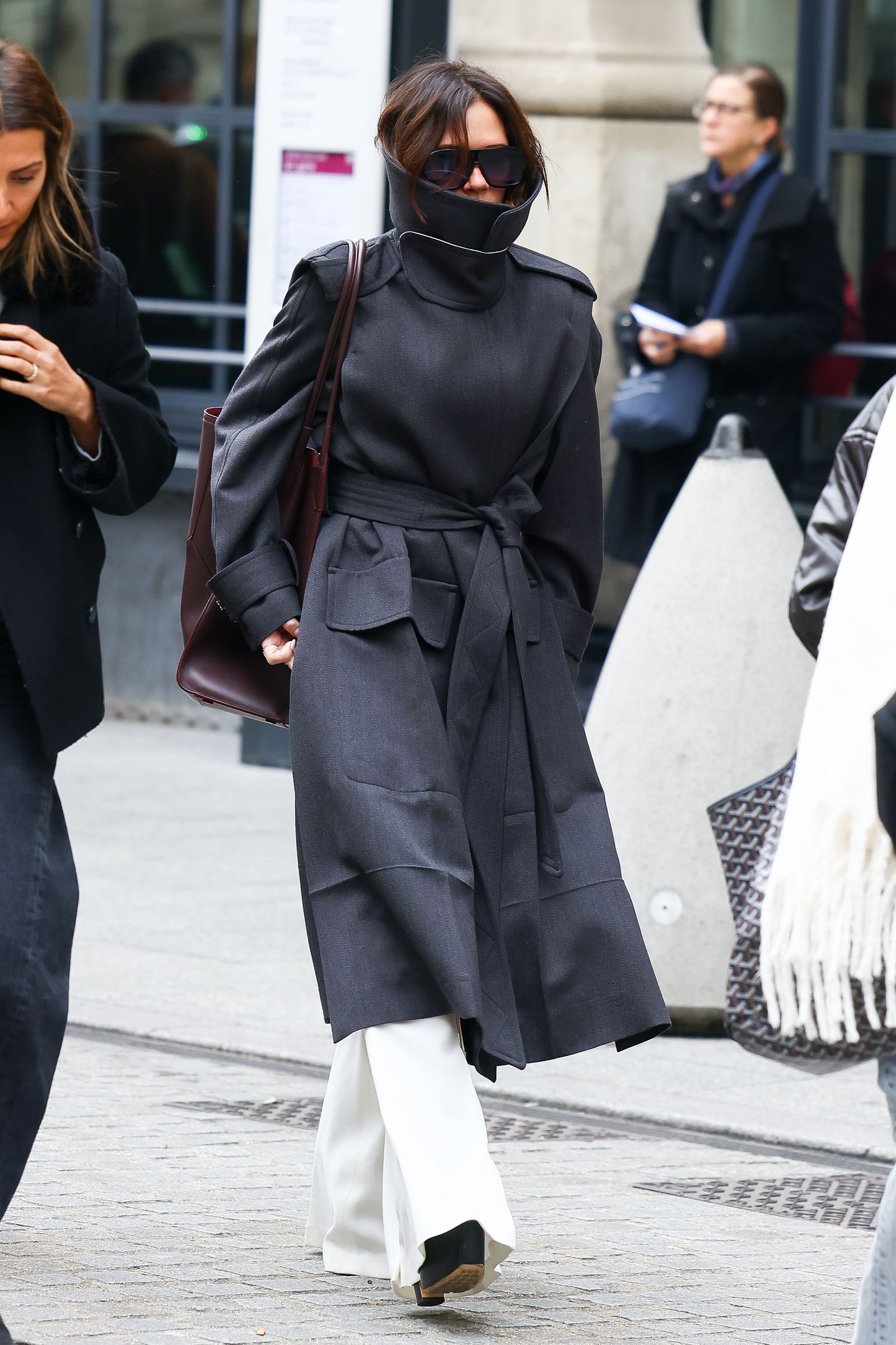 Victoria Beckham Styled a Funnel Neck Coat With Her Favourite Puddle ...
