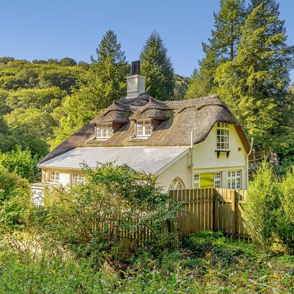 Step inside this chocolate-box cottage with breathtaking riverside ...