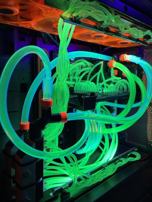 This fluorescent gaming PC has 69 water blocks to keep it frosty | PC Gamer