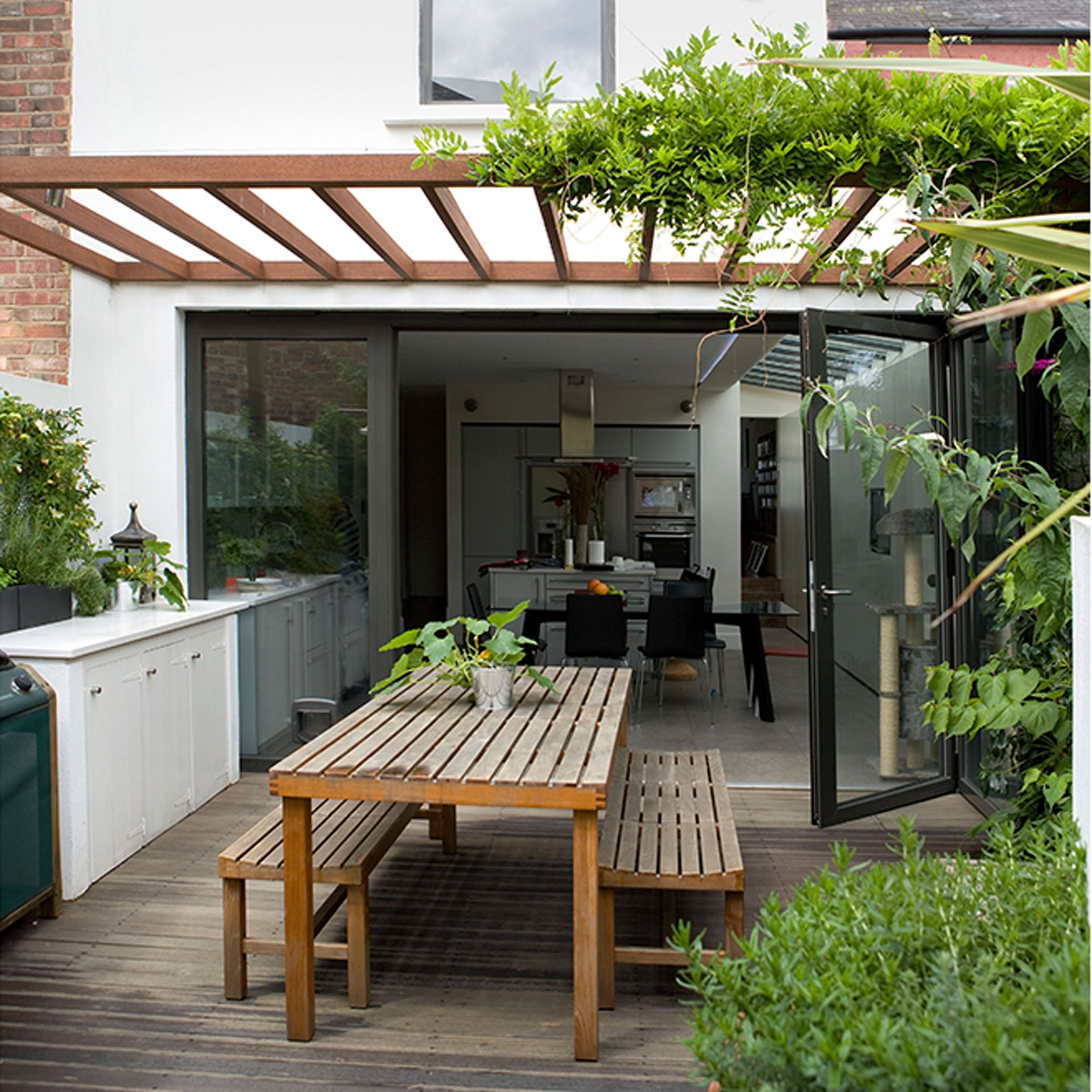 11 covered outdoor kitchen ideas for sheltered cooking and dining ...