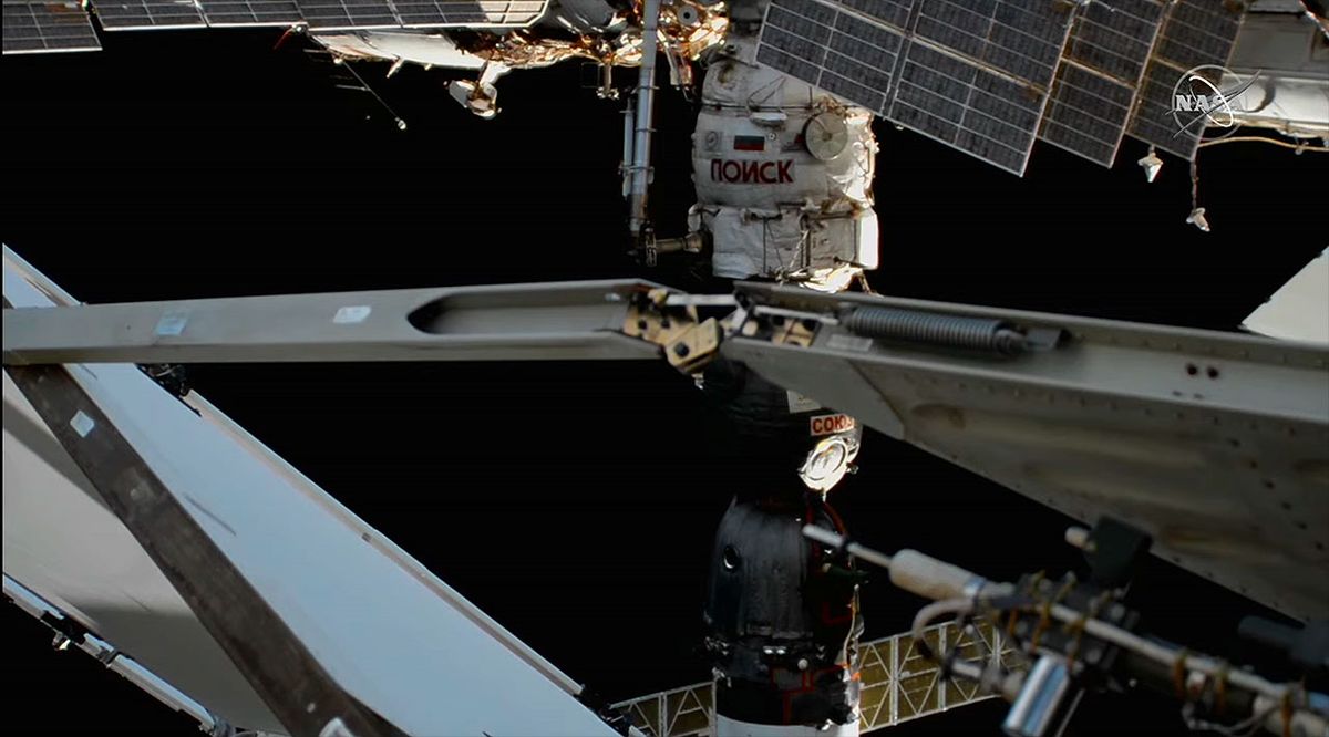 Space station crew moves Soyuz spacecraft to new parking spot ahead of ...
