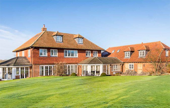A spectacular country house on the South Downs with stables and a ...