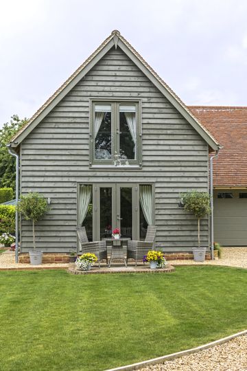 This oak frame house has views on to a pretty garden and pond | Homes ...