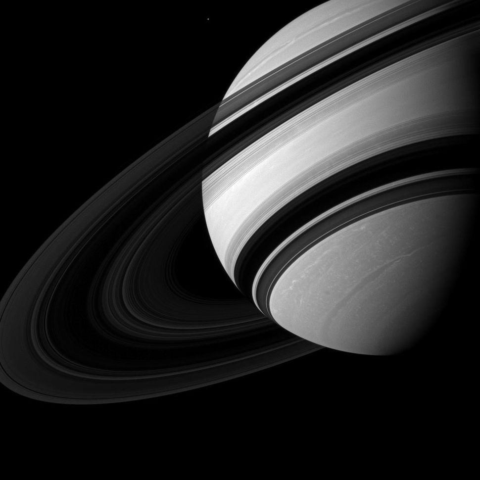 Amazing Photo Shows Saturn Dwarfing Tiny Moon | Space