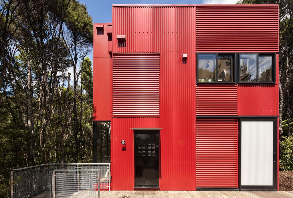 Colour pop: this bright red New Zealand house stands out in its leafy ...