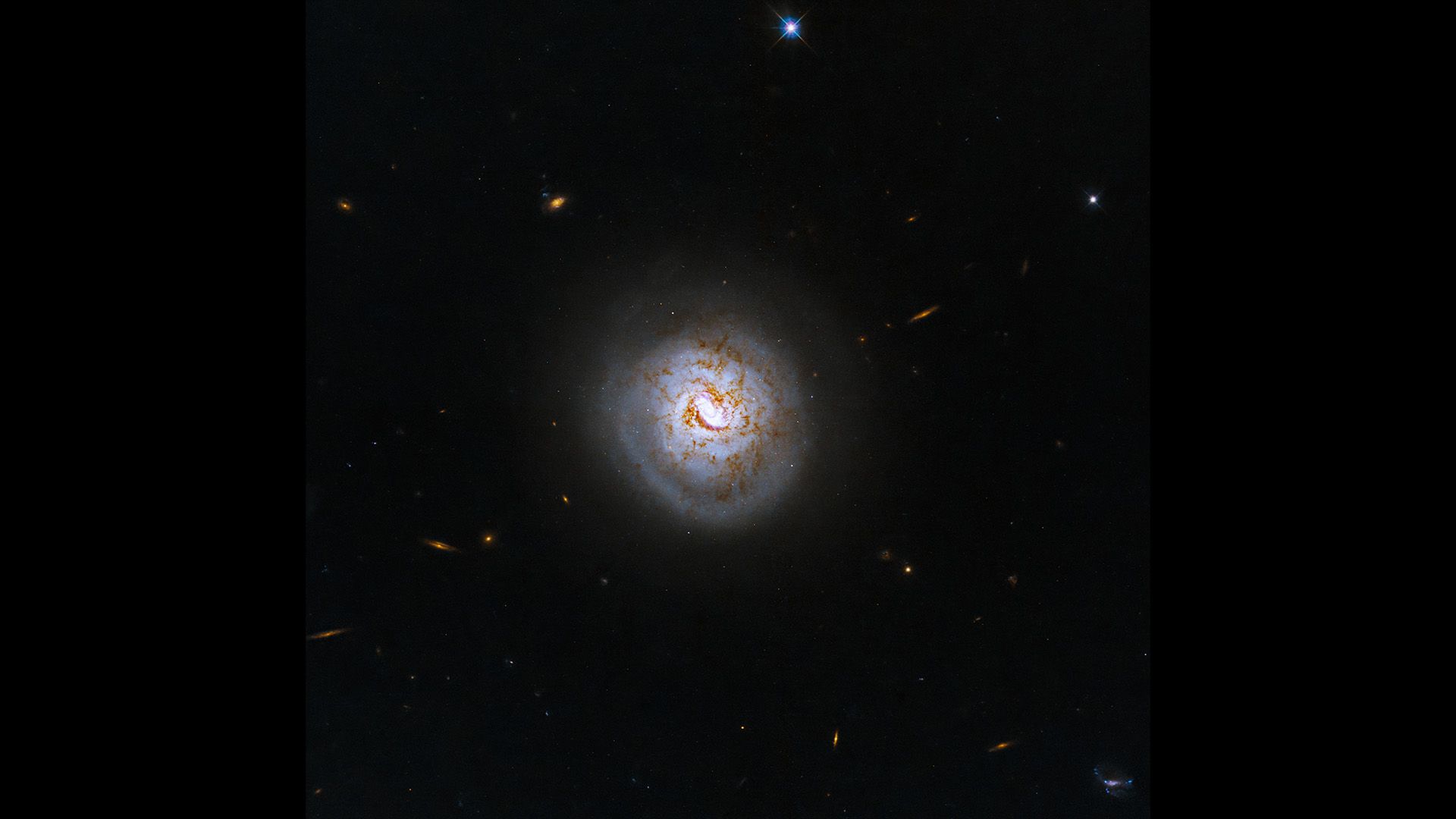 Space photo of the week: Hubble catches a 'baseball galaxy' with a ...