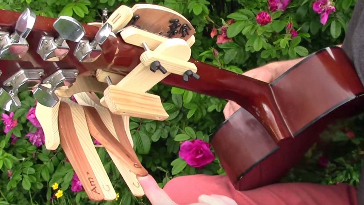 Don't bother learning guitar: this mechanical contraption does the hard ...