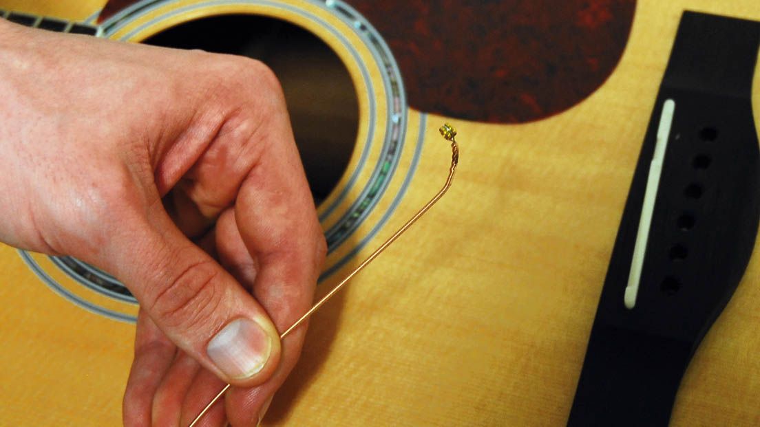 Guitar setup: how to remove bridge pins on an acoustic guitar | MusicRadar