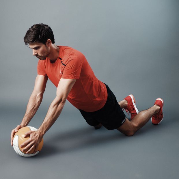 The 15-Minute Medicine Ball Workout That Challenges Your Core | Coach