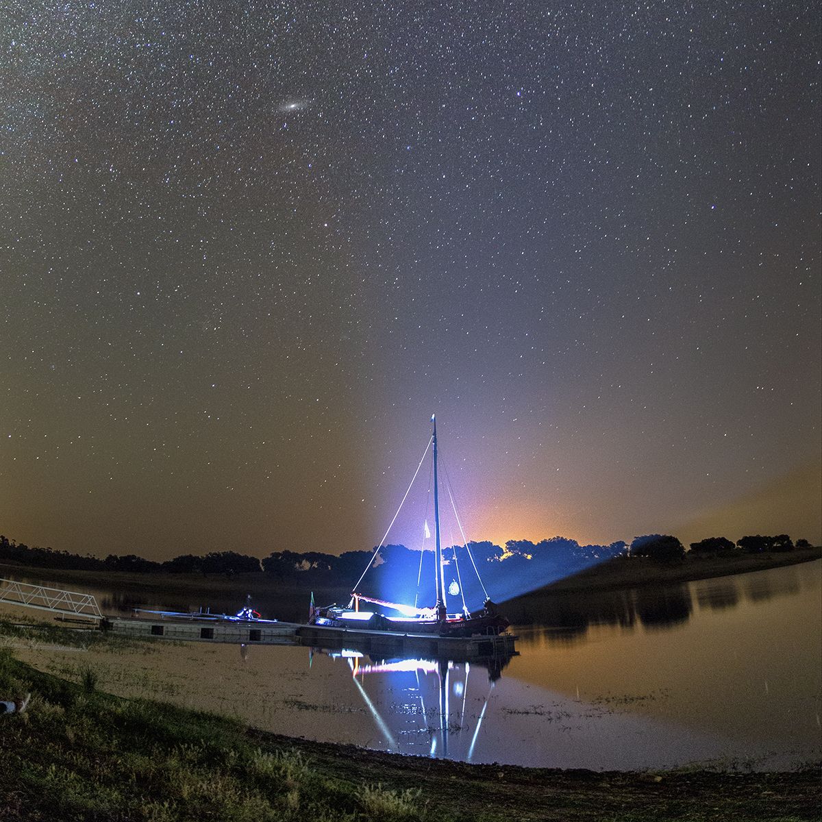 The Milky Way and Andromeda Loom Over a Dutch Sailboat in a ...