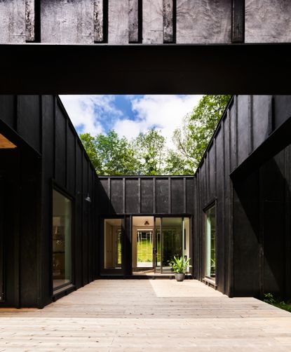 This minimalist house has a modern take on wall paneling we love