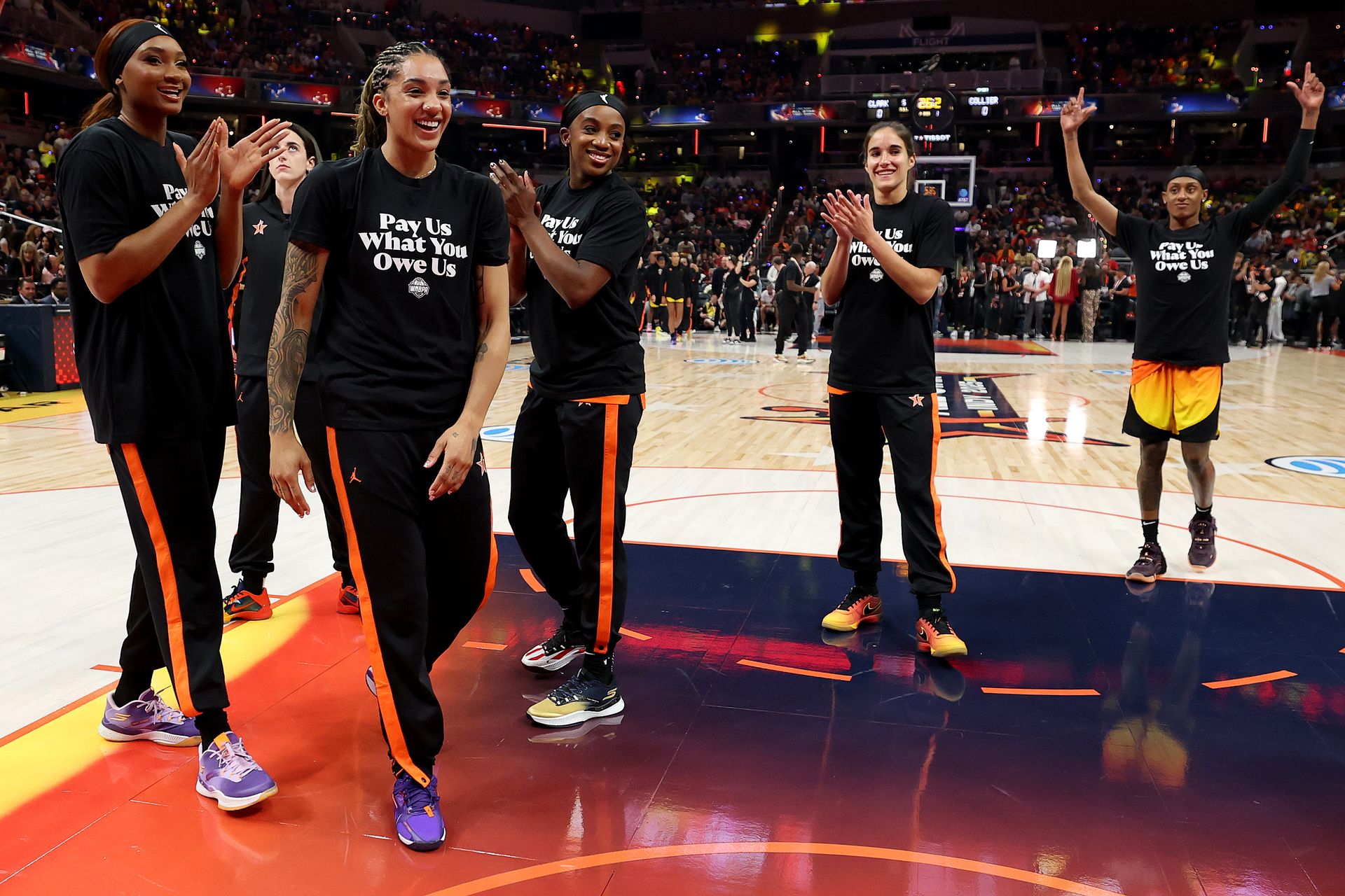 How “Pay Us What You Owe Us” Tees Became WNBA 2025 All-Star Weekend’s ...
