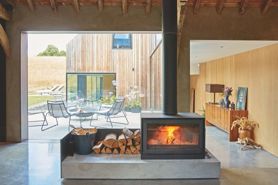 Corner log burner ideas for a cosy living space | Homebuilding