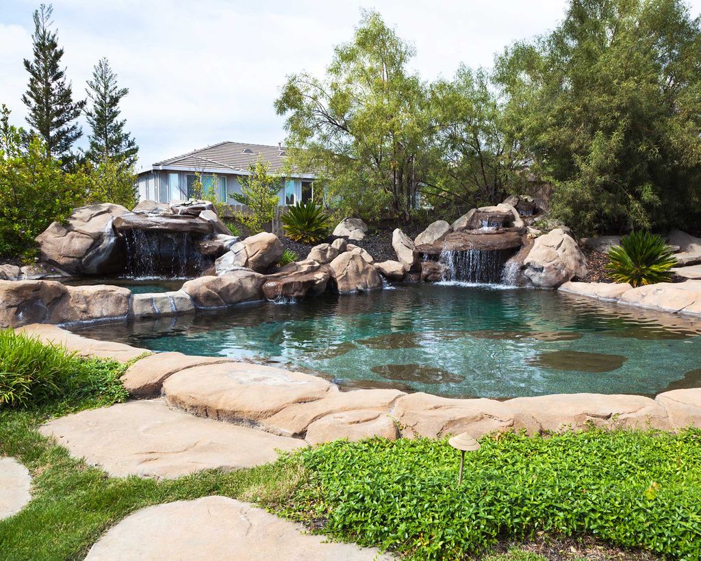 Pool waterfall ideas: 10 looks to elevate your swimming pool | Gardeningetc