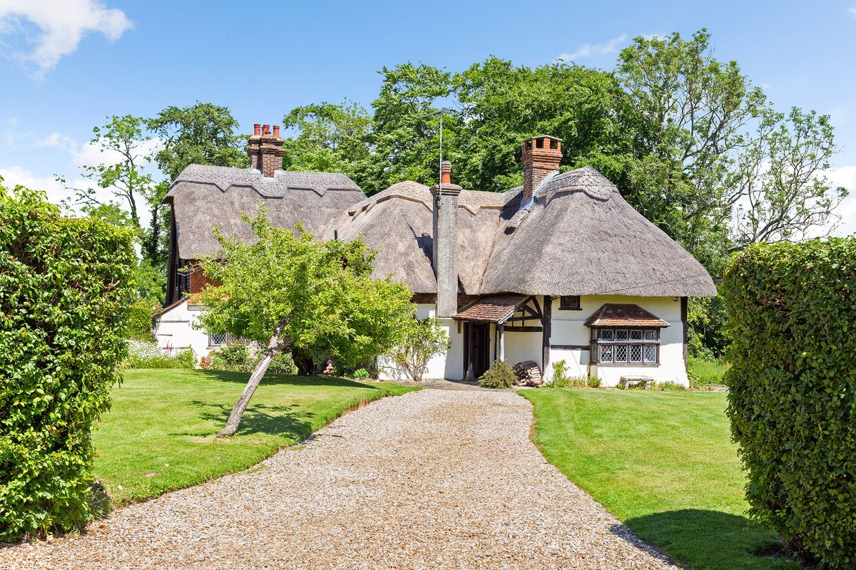 A gorgeous thatched cottage for sale with stables and pool, an easy ...