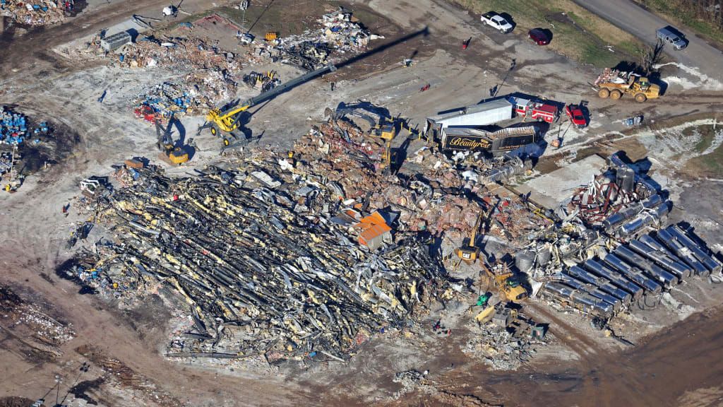 Workers at factory destroyed by tornado say they were threatened with ...