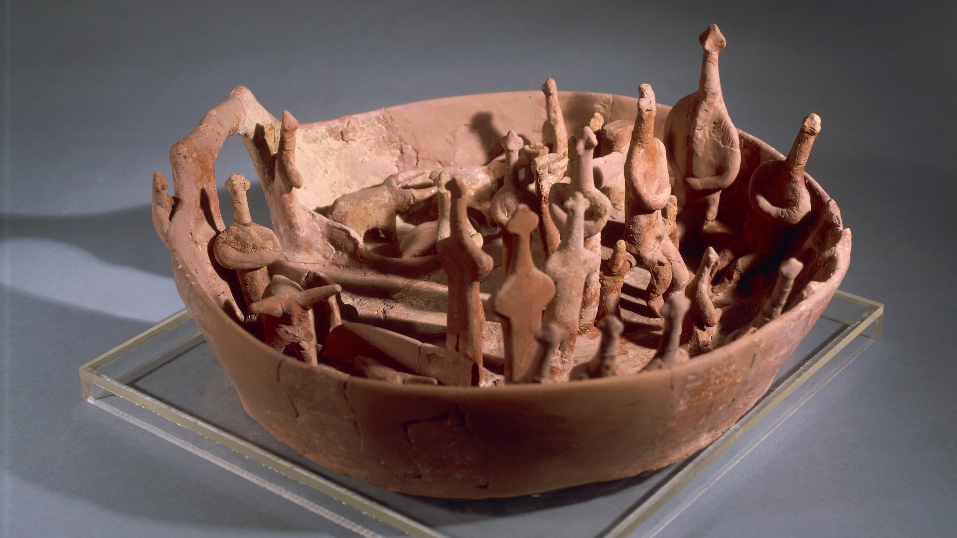 Vounous Bowl: A 4,000-year-old basin holding 4 miniature cows and 18 ...