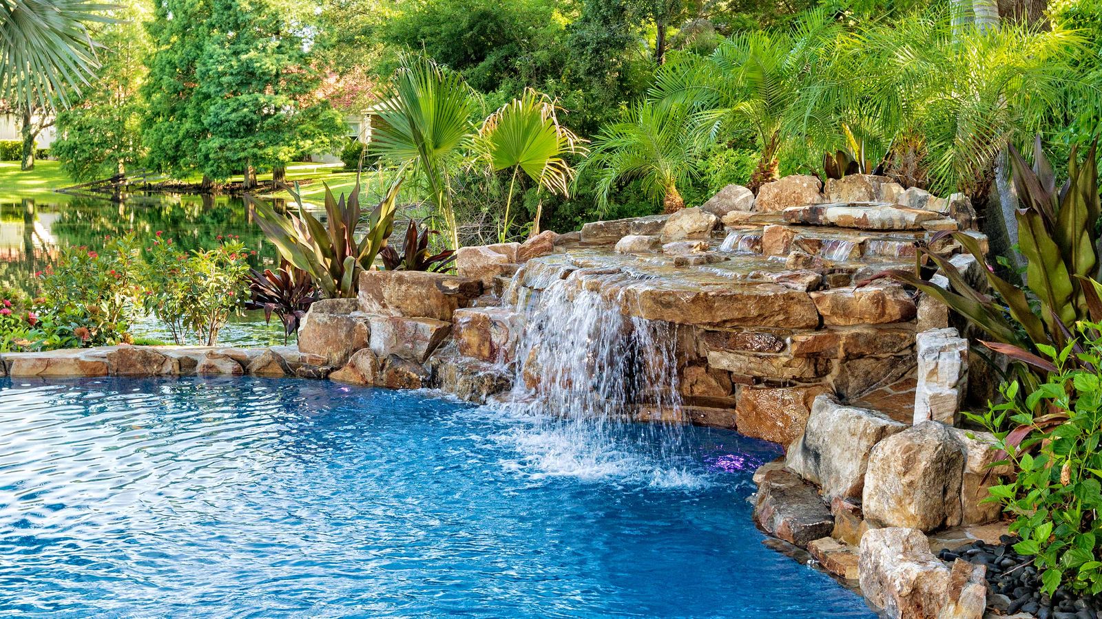 Pool waterfall ideas: 10 looks to elevate your swimming pool | Gardeningetc
