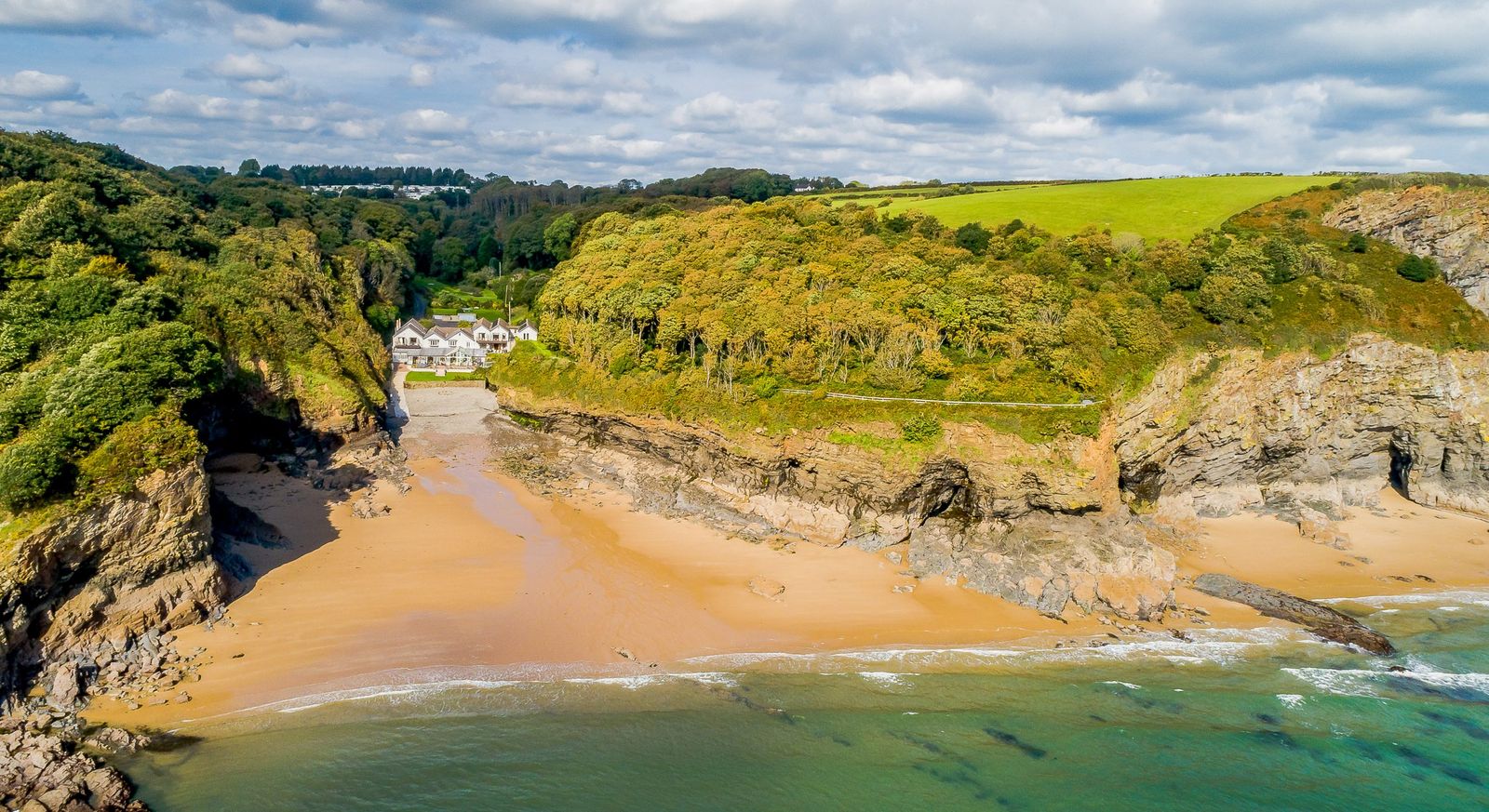 A gorgeously secluded home set on its own private beach that's a ...
