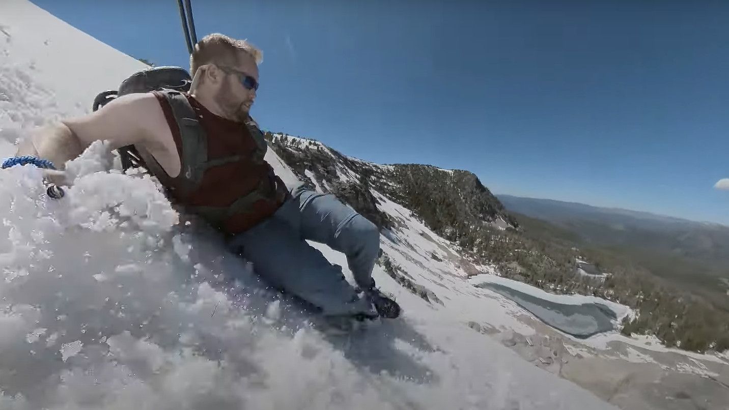 Watch hiker narrowly avoid disaster as he slides over 700ft down icy ...