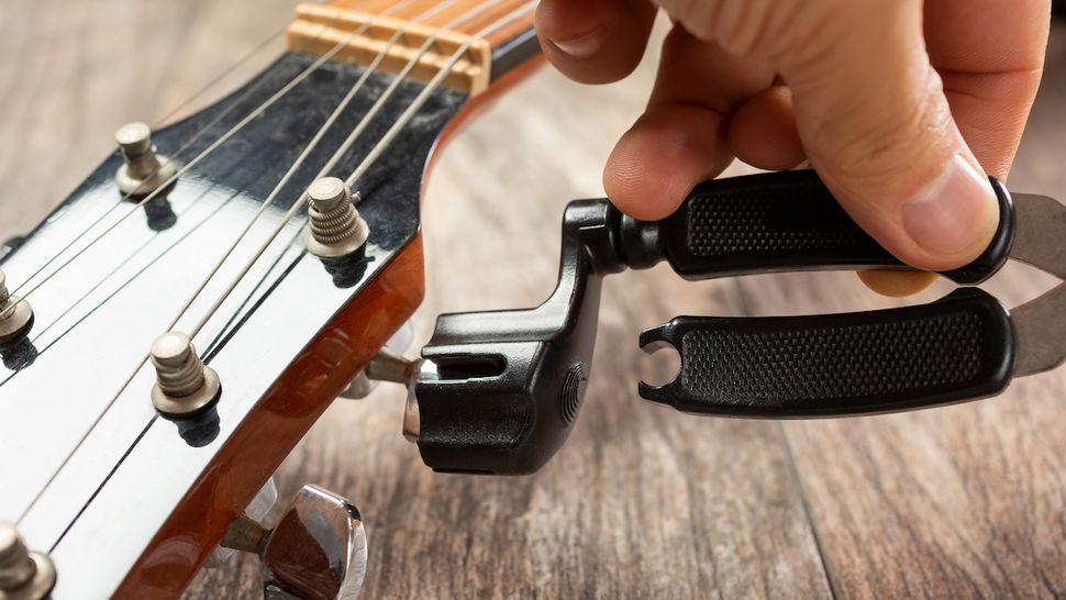 How to restring an acoustic guitar: step-by-step guidance from a ...
