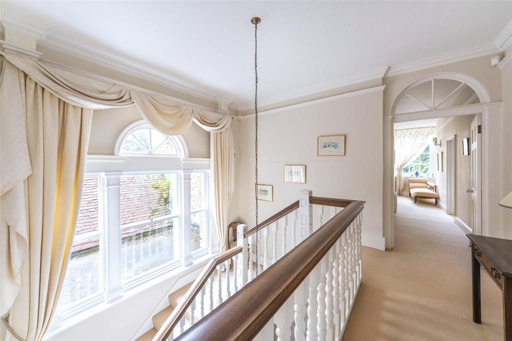 A Regency-style manor house set amid orchards, woodland and lawns that ...
