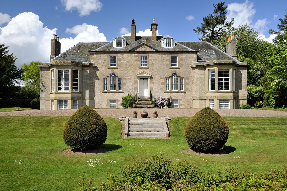 A Scottish country house in the Borders with stables, a coach house ...