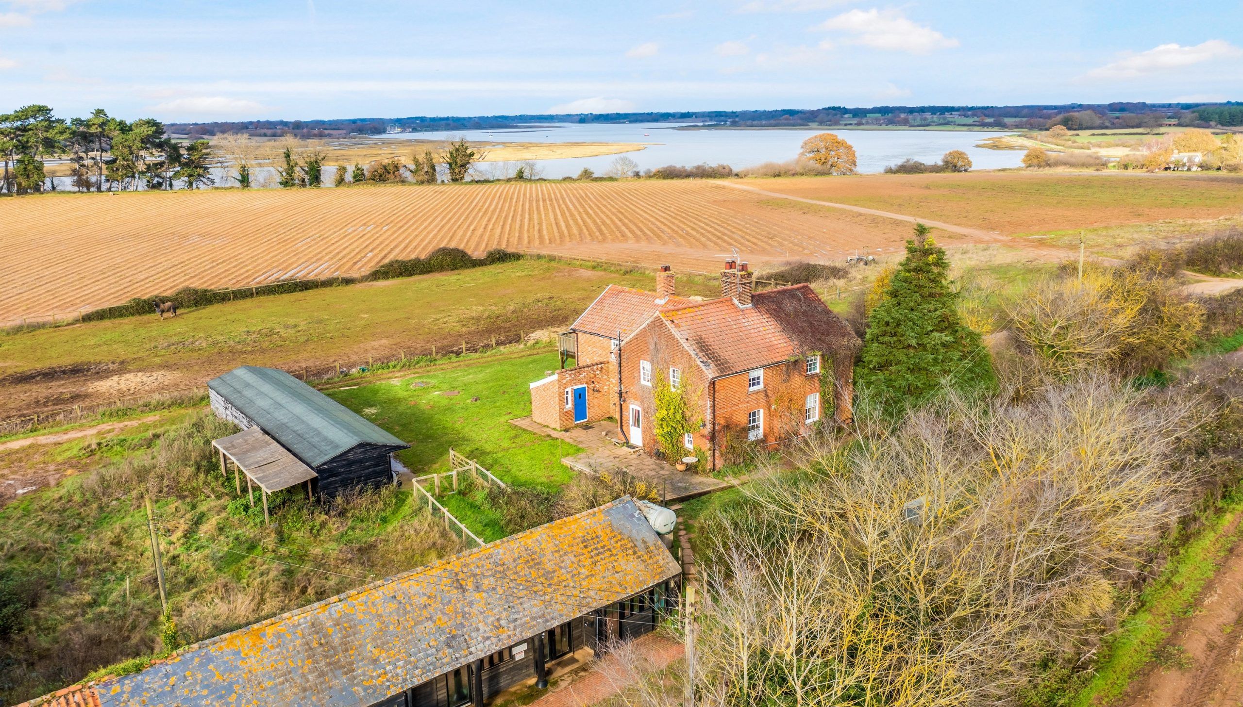 A Suffolk farmhouse with its own private beach, stables and 141 acres ...
