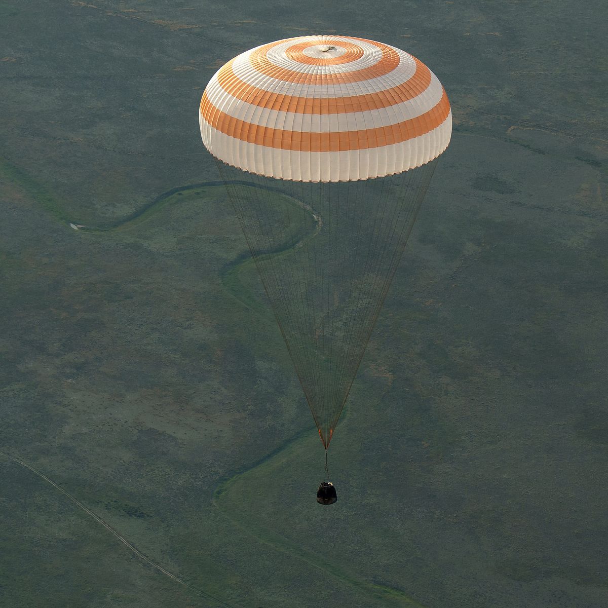 Soyuz Capsule Returns Trio to Earth After Nearly 200 Days on Space ...
