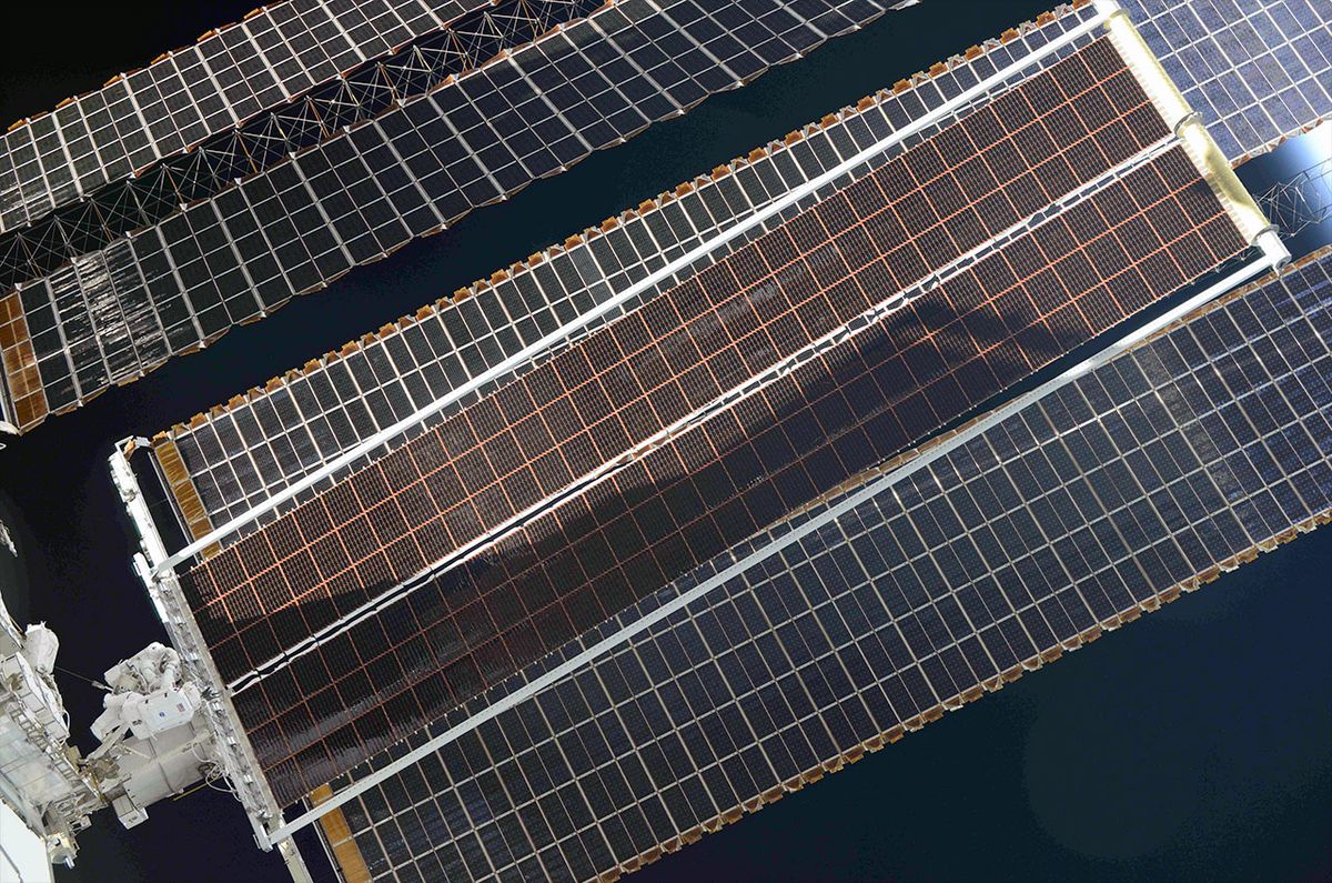 Astronauts On Spacewalk Deploy First Roll Out Solar Array To Boost