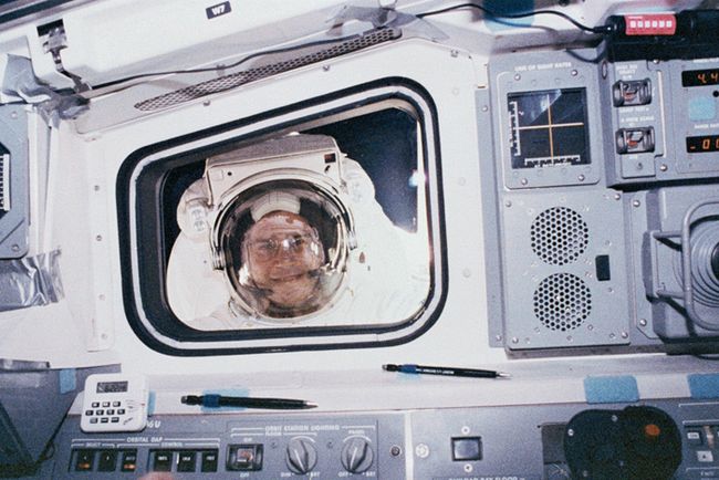 Space History Photo: Rick Hieb Peers Into The Flight Deck | Space
