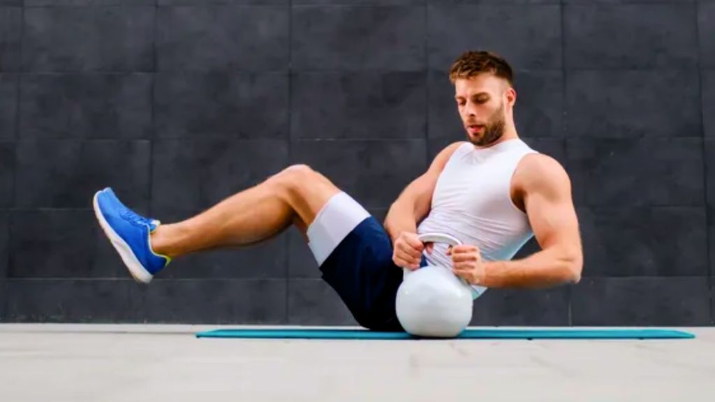 Forget sit-ups — you only need 1 kettlebell and 3 seated ab exercises ...