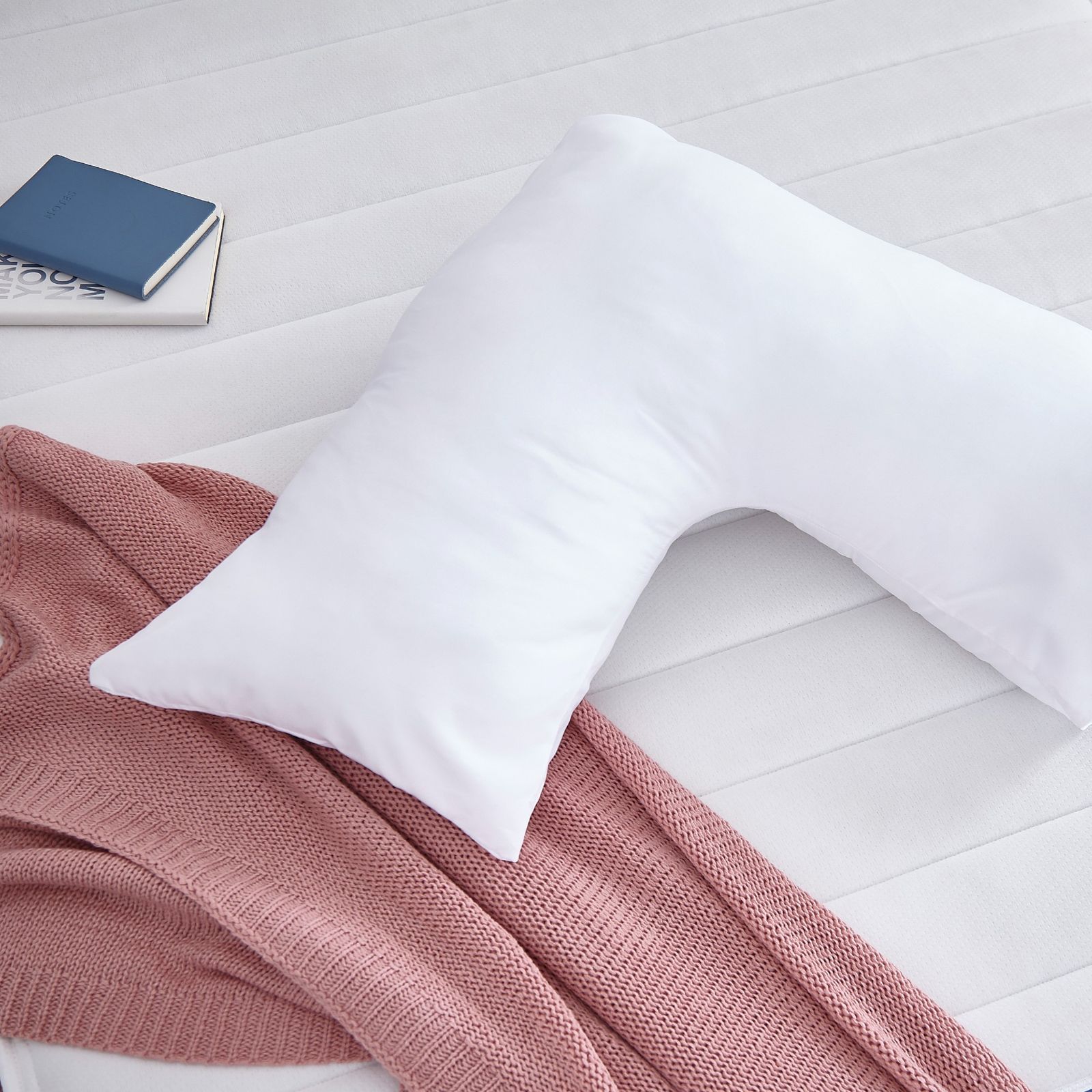 Do you need to swap to a V-shaped pillow? Experts reveal all | Ideal Home
