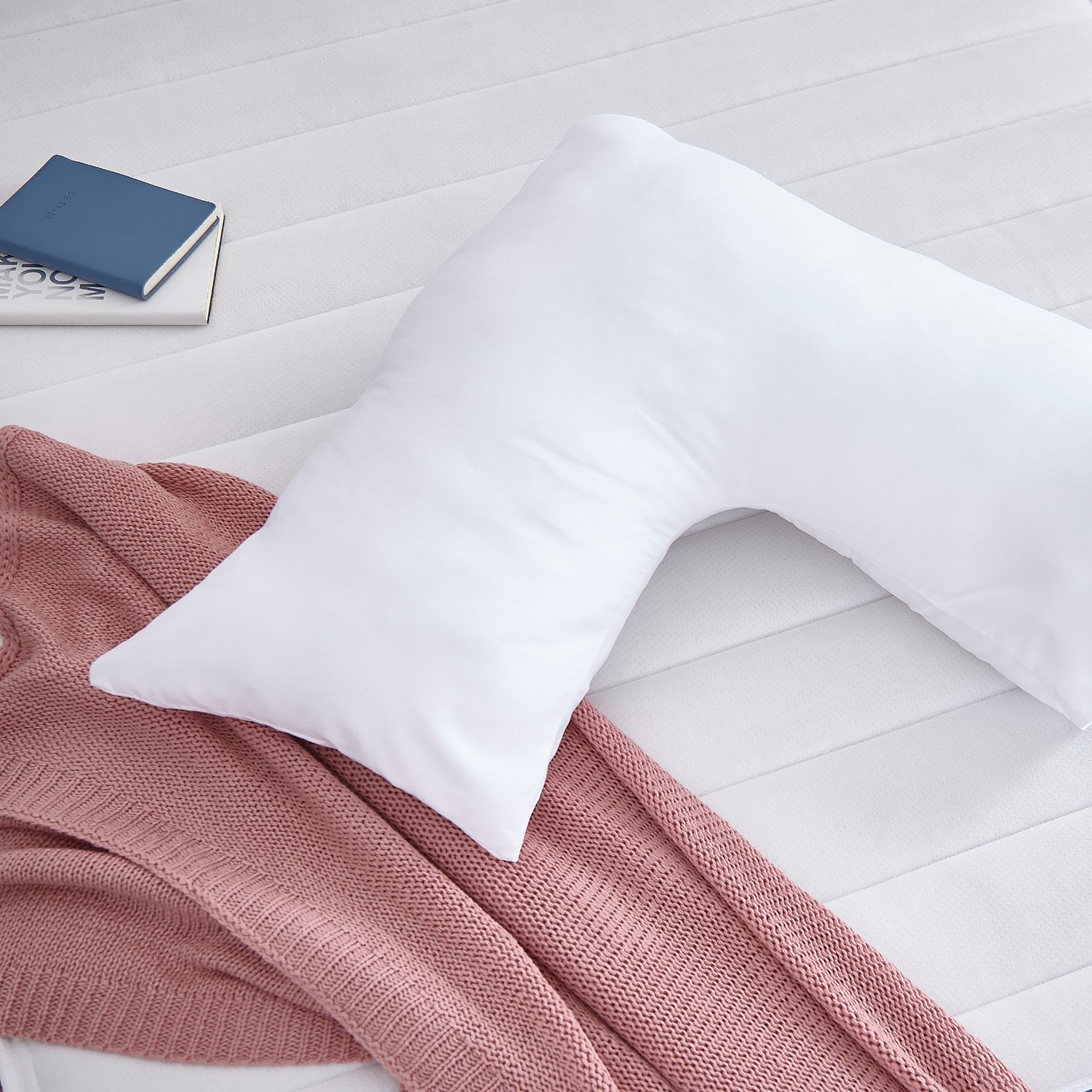 Do you need to swap to a V-shaped pillow? Experts reveal all | Ideal Home
